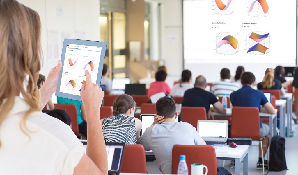 teacher sharing content from the back of classroom - The ScreenBeam Blog